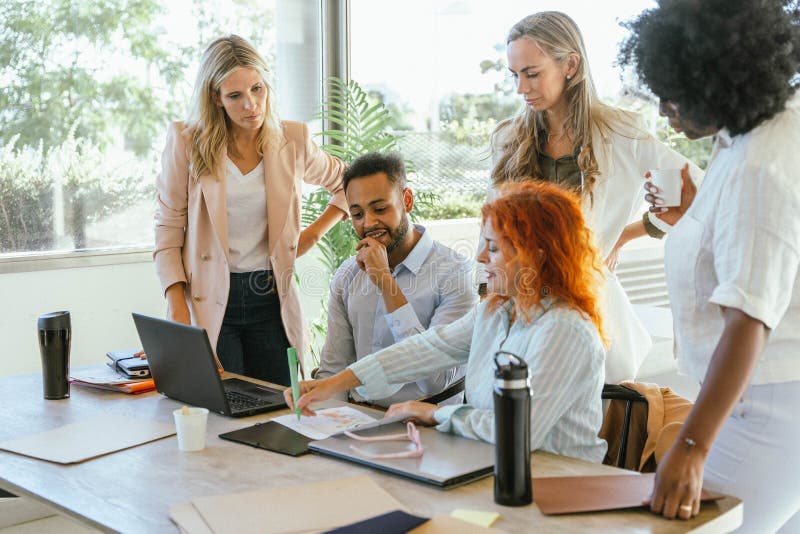 Diverse Group of Work Colleagues Planning a Strategy for a Work Project ...