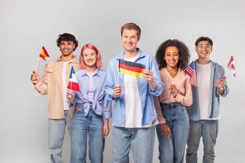 Diverse Group of Young Adults Holding Flags Against White Background ...