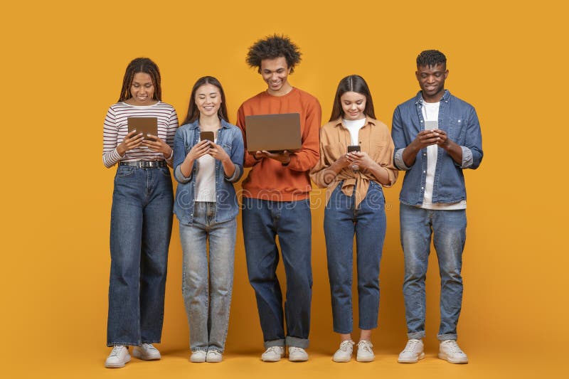 Diverse Group Young Adults Using Technology Yellow Background Stock ...