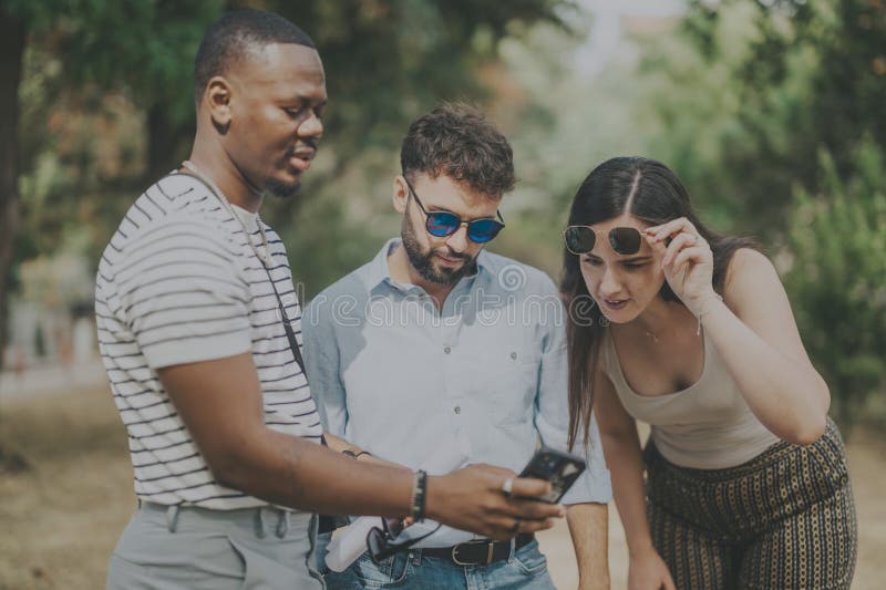 Group of Young Business People Interacting Outside with Smart Phone ...
