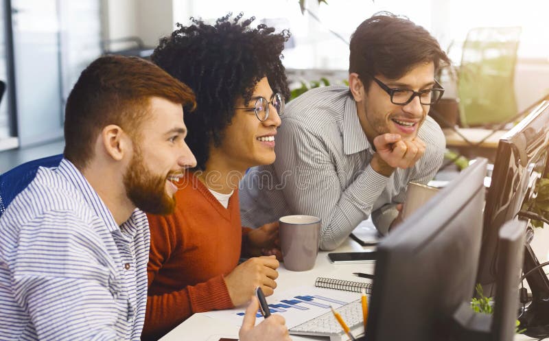 Diverse Group of Young Professionals Engaged in Collaborative Work ...