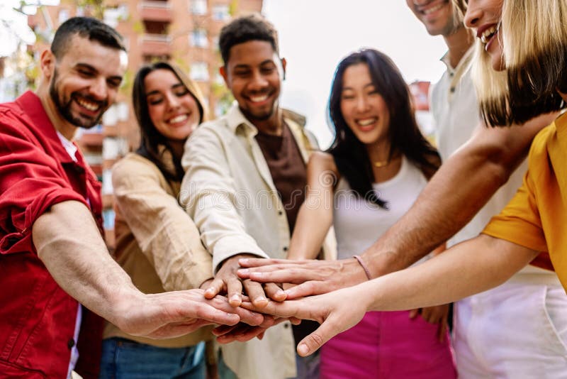 Diverse Group of Young Students Stacking Hands Together Stock Image ...