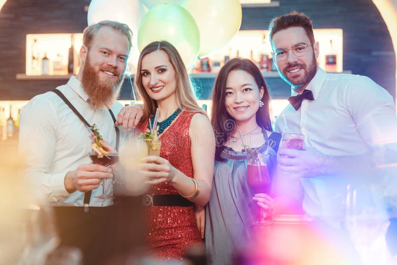 Diverse Happy Young Friends Enjoying Drinks at Party Stock Photo ...