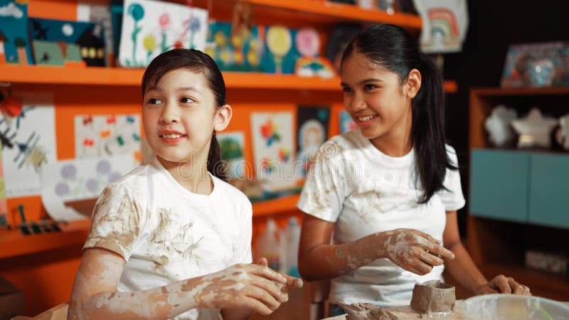 Diverse Highschool Student Modeling Cup of Clay at Art Lesson ...