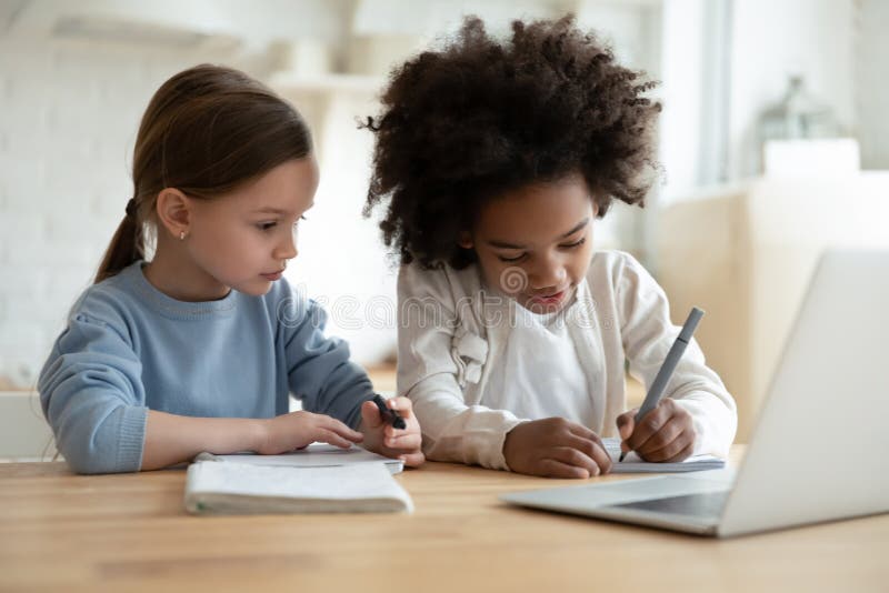 Diverse Little Sisters Study Online on Laptop Together Stock Photo ...