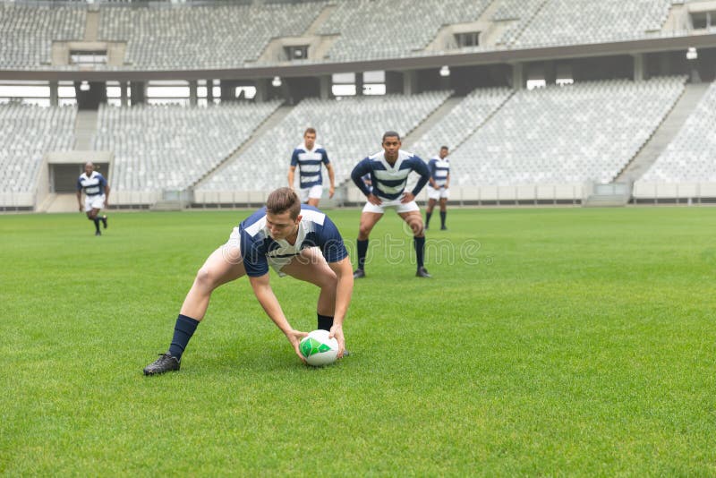 Diverse Male Rugby Players Playing Rugby Match in Stadium Stock Image ...