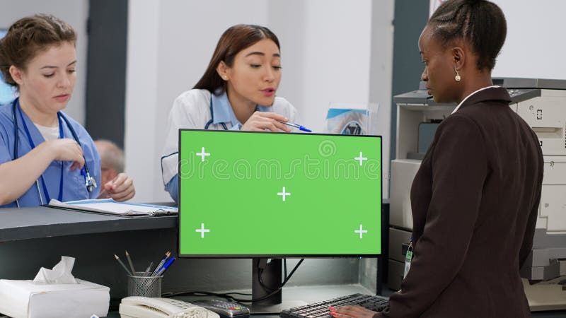 Diverse Medical Staff Working with Greenscreen on Computer Stock Photo ...