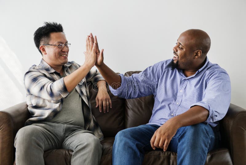 Diverse Men Joining Hands Together Stock Image - Image of african ...