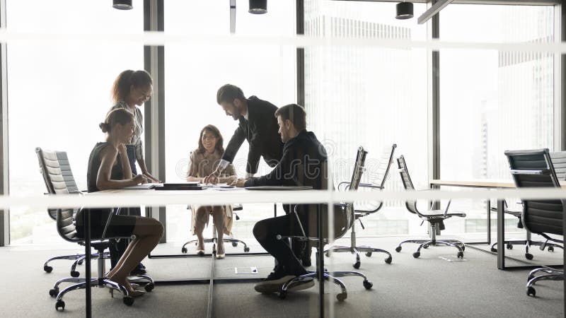 Diverse Millennial Professional Meeting in Modern Office Co-working ...