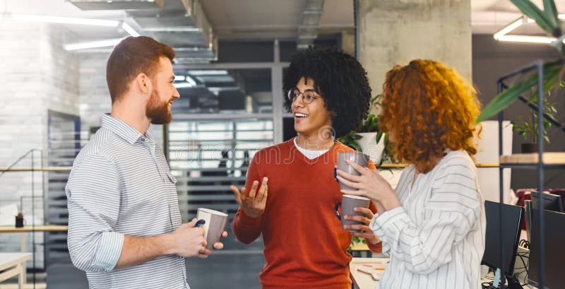 Diverse Millennials Enjoying Communication in Modern Office Stock Photo ...