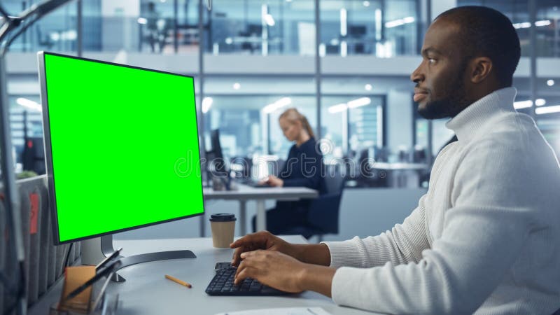 Diverse Modern Office: Handsome Black Businessman Using Desktop ...