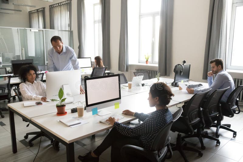 Diverse Multi-ethnic People Employees Working Together in Shared Stock ...