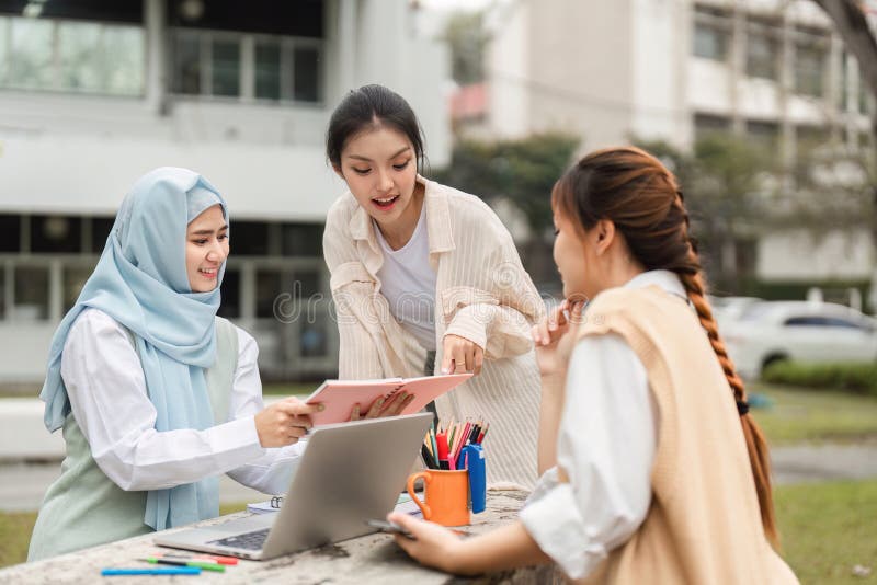 Diverse Women Collaborating Project Outdoors Laptop Tablet Stock Photos ...