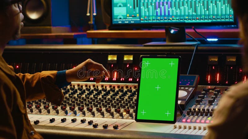 Diverse Music Experts Working with Greenscreen on Tablet and Mixing ...