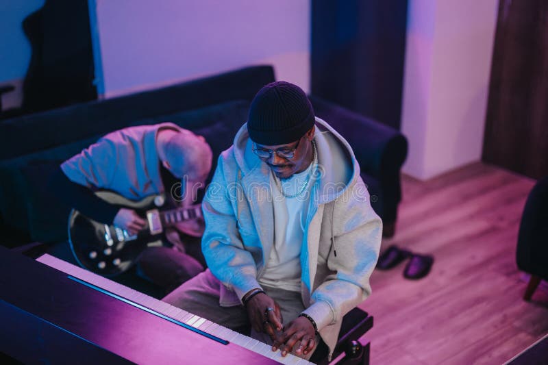 Diverse Musicians Collaborating in a Modern Music Studio Environment ...