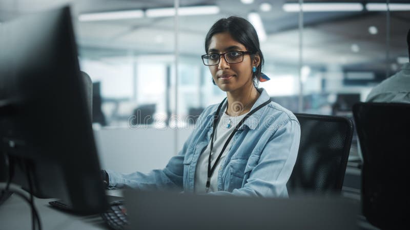 Diverse Office Portrait Of Talented Indian Girl It Programmer Working On Desktop Computer In