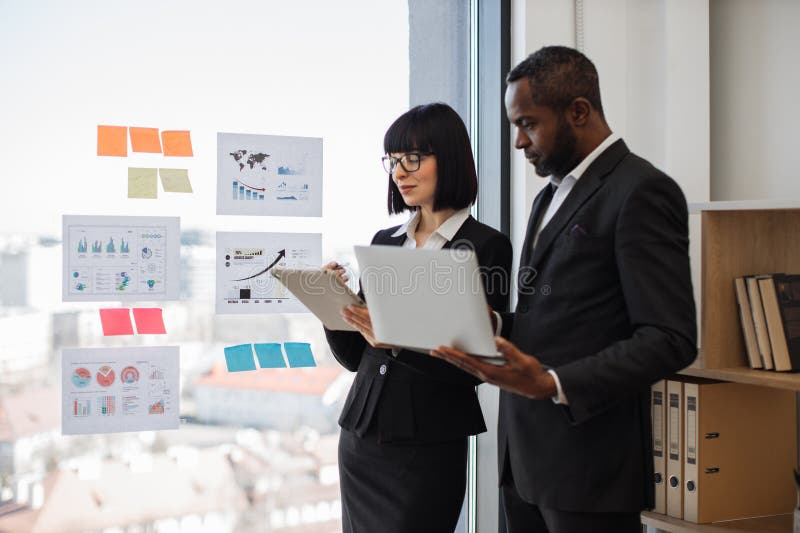 Diverse Office Workers Checking Data Using Electronic Device Stock ...