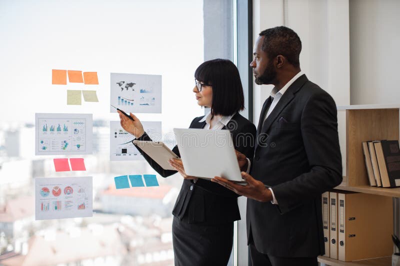 Diverse Office Workers Checking Data Using Electronic Device Stock ...