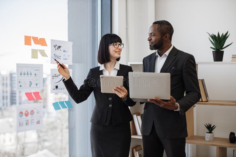 Diverse Office Workers Checking Data Using Electronic Device Stock ...