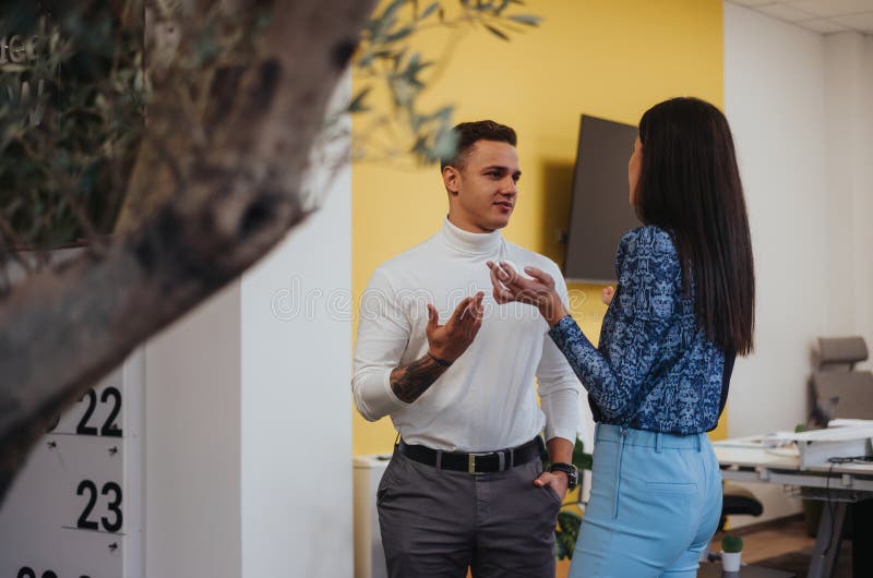 Diverse People Collaborating in a Modern Office, Using Technology ...