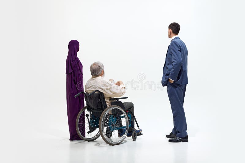 Diverse People, Including Man in Wheelchair, Look Forward while ...