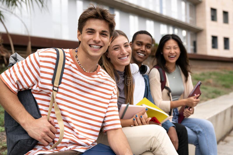 Diverse People Smiling Sitting Outside Holding Folders. Multicultural ...
