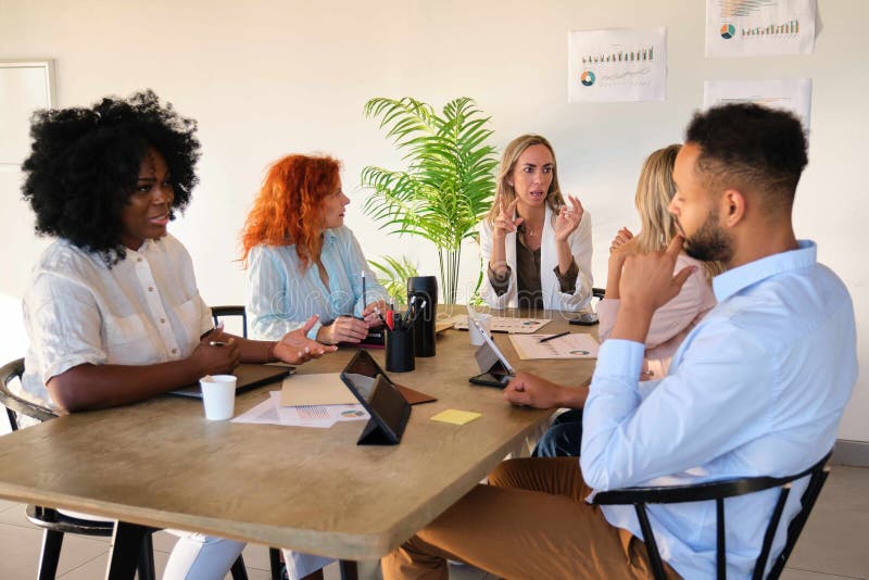 Diverse Professional Executive Team Working and Brainstorming at a ...