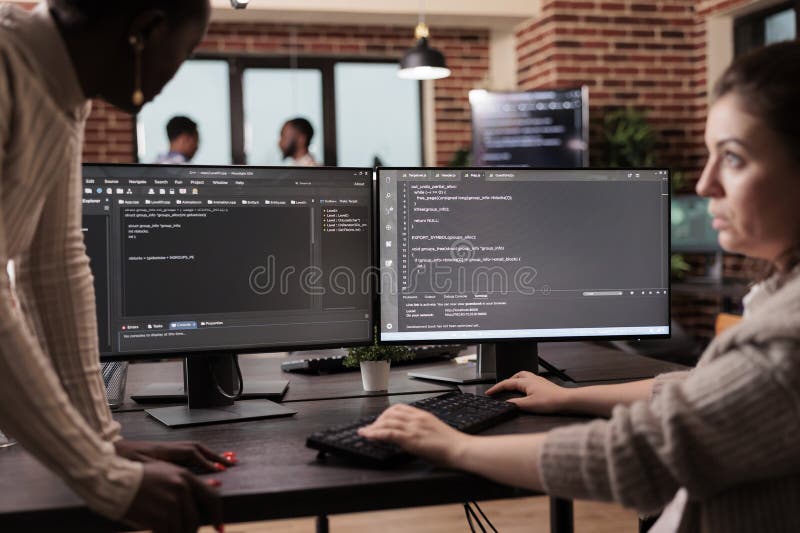 Diverse Programming Engineers Talking About Html Script Stock Image