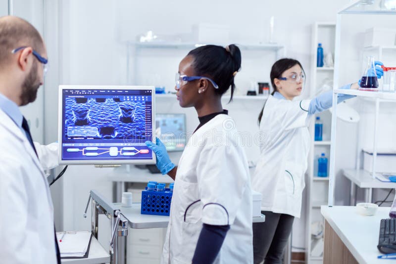 Diverse Scientists Solve Problems and Point at Computer Screen Stock ...