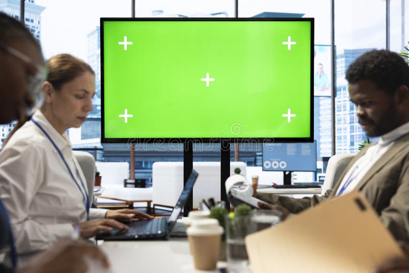 Diverse Staff Working with Analytics Next To Green Screen on ...