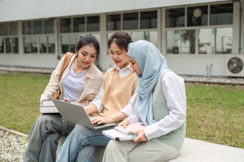Diverse Students Collaborating with a Laptop and Study Materials ...