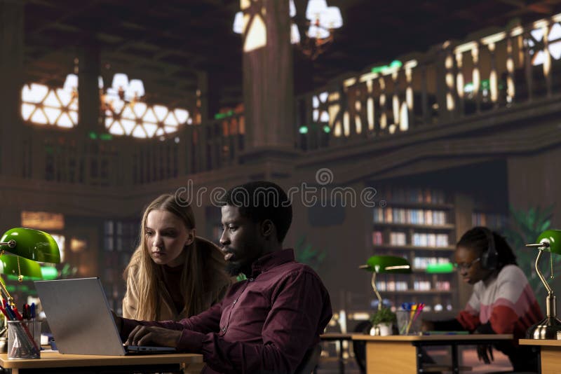 Diverse Students Working Together on a College Assignment at the ...