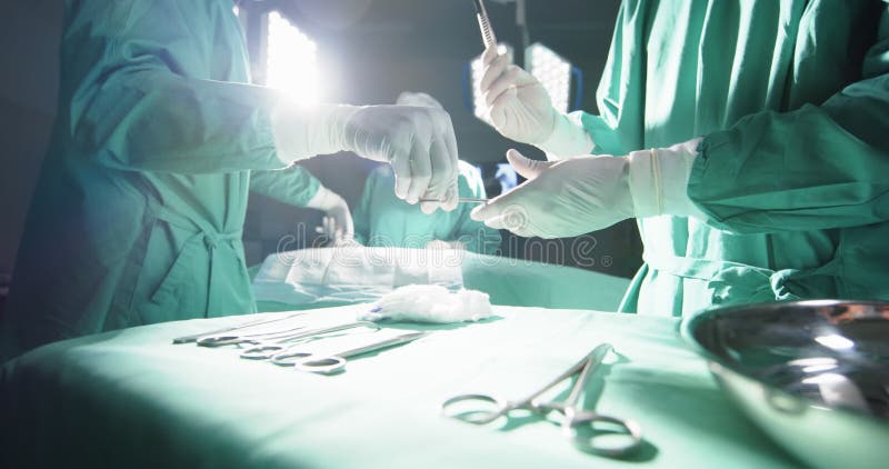 Diverse Surgeons Using Surgical Instruments in Operating Theatre at ...