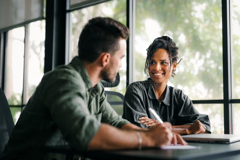 A Diverse, Talented Team Collaborates Effectively in a Bright Office ...