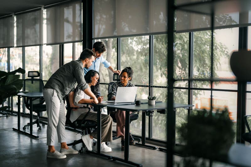 A Diverse, Talented Team Collaborates Effectively in a Bright Office ...