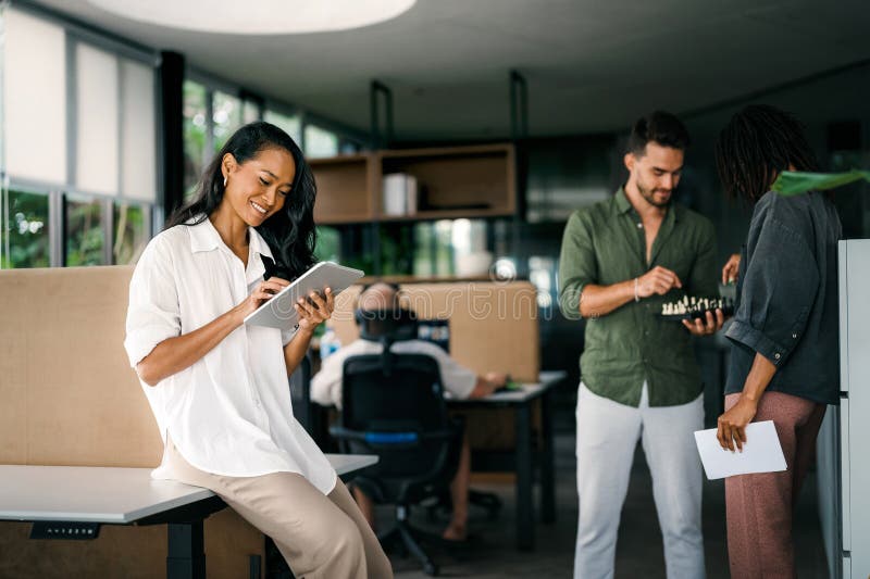 A Diverse, Talented Team Collaborates Effectively in a Bright Office ...