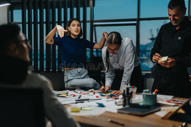 Diverse Team Brainstorming Ideas during Evening Meeting in Office Stock ...