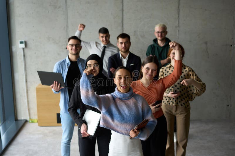 A Diverse Team of Business Professionals Ecstatically Celebrating Their ...