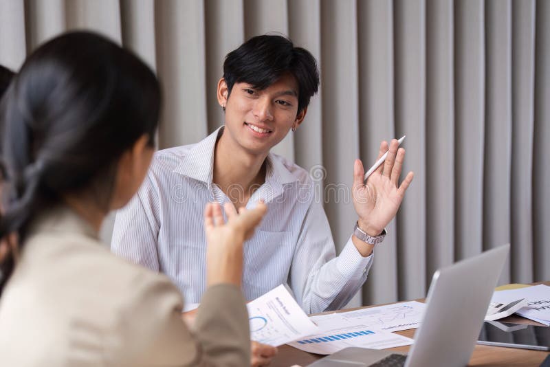 Diverse Team of Business Professionals Engaging in a Collaborative ...