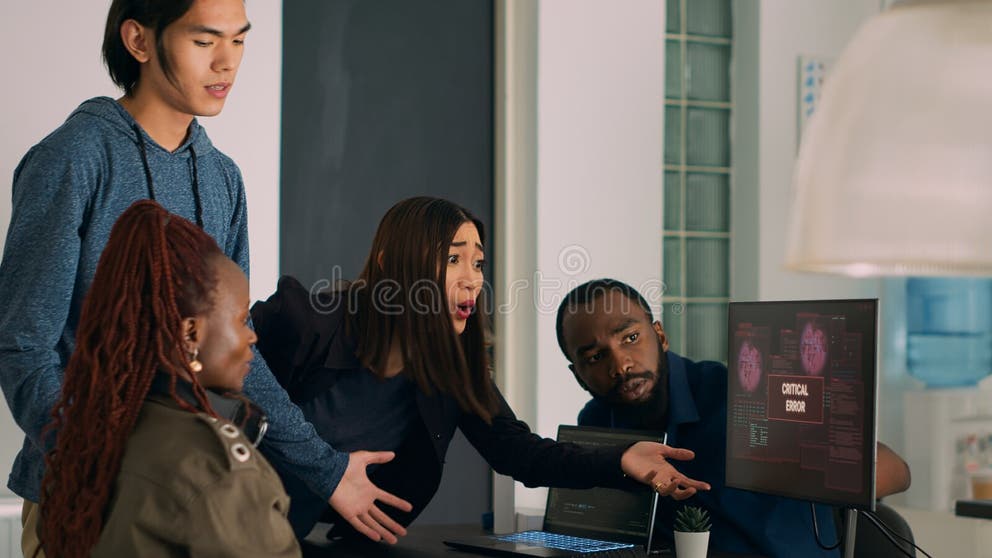 Diverse Team of Coders Dealing with Security Breach Alert on Computer Stock Photo - Image of ...