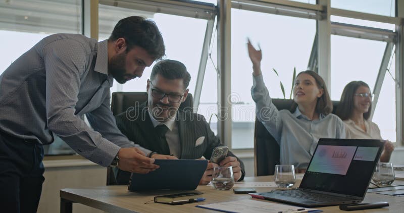 Diverse Team Collaborates on Business Strategy in a Modern Office ...