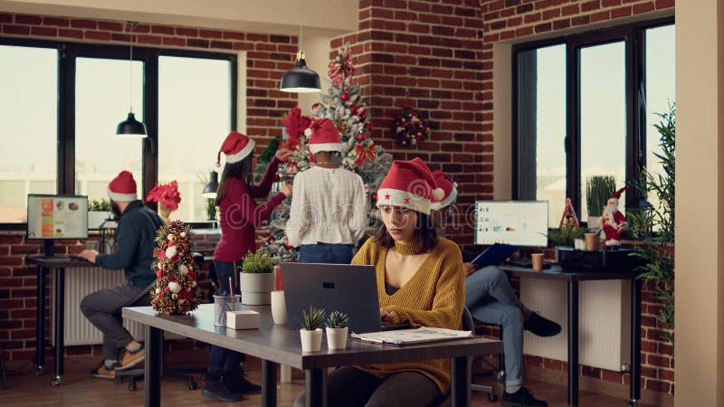 Diverse Team of Colleagues Analyzing Data in Festive Office Stock Image ...