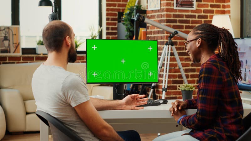 Diverse Team of Colleagues Looking at Computer with Greenscreen Stock ...