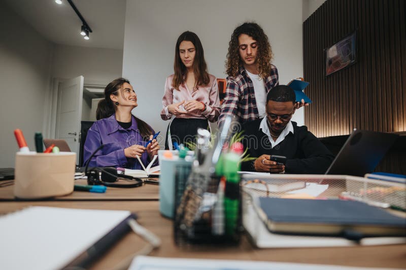 Diverse Team of Entrepreneurs Engaging in Project Discussion in Modern ...