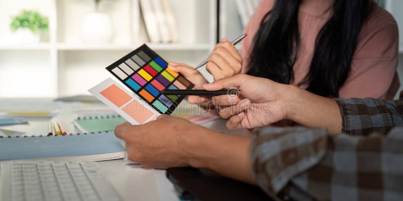 Diverse Team Evaluating Color Palettes for Graphic Design Project ...