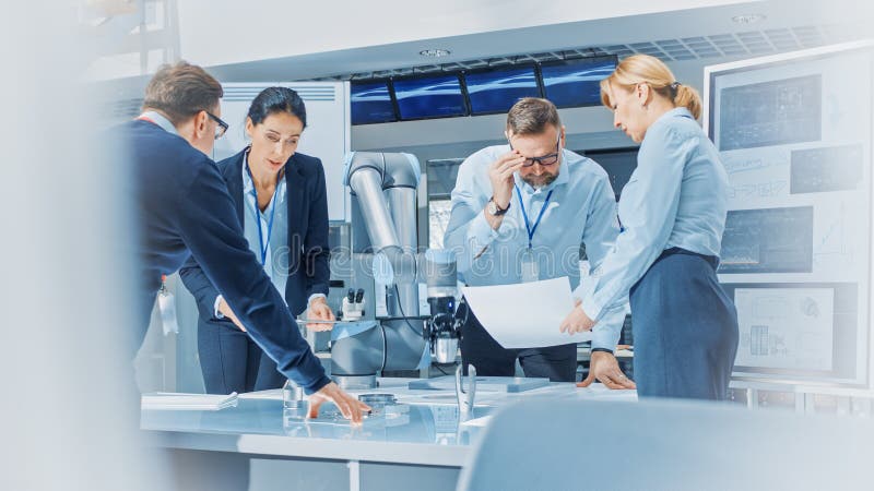 Industrial Robotics Teamwork Working with Auto Parts Parts on Smart ...