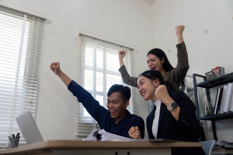 Excited Team Celebrating Success in a Modern Office, Showcasing ...