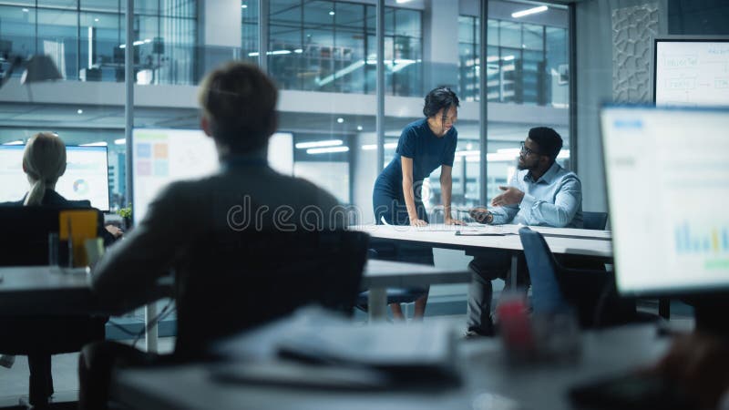 Diverse Team of Managers Working and Having Discussions in Modern Big ...