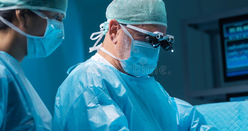 Team of Medical Doctors Performs Surgical Operation in Modern Operating ...