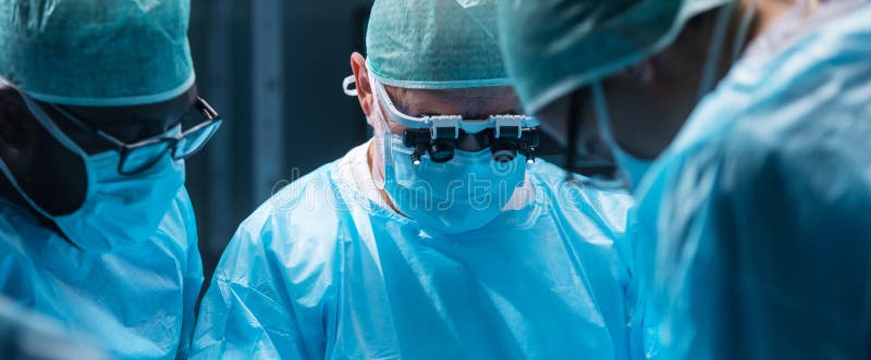 Team of Medical Doctors Performs Surgical Operation in Modern Operating ...